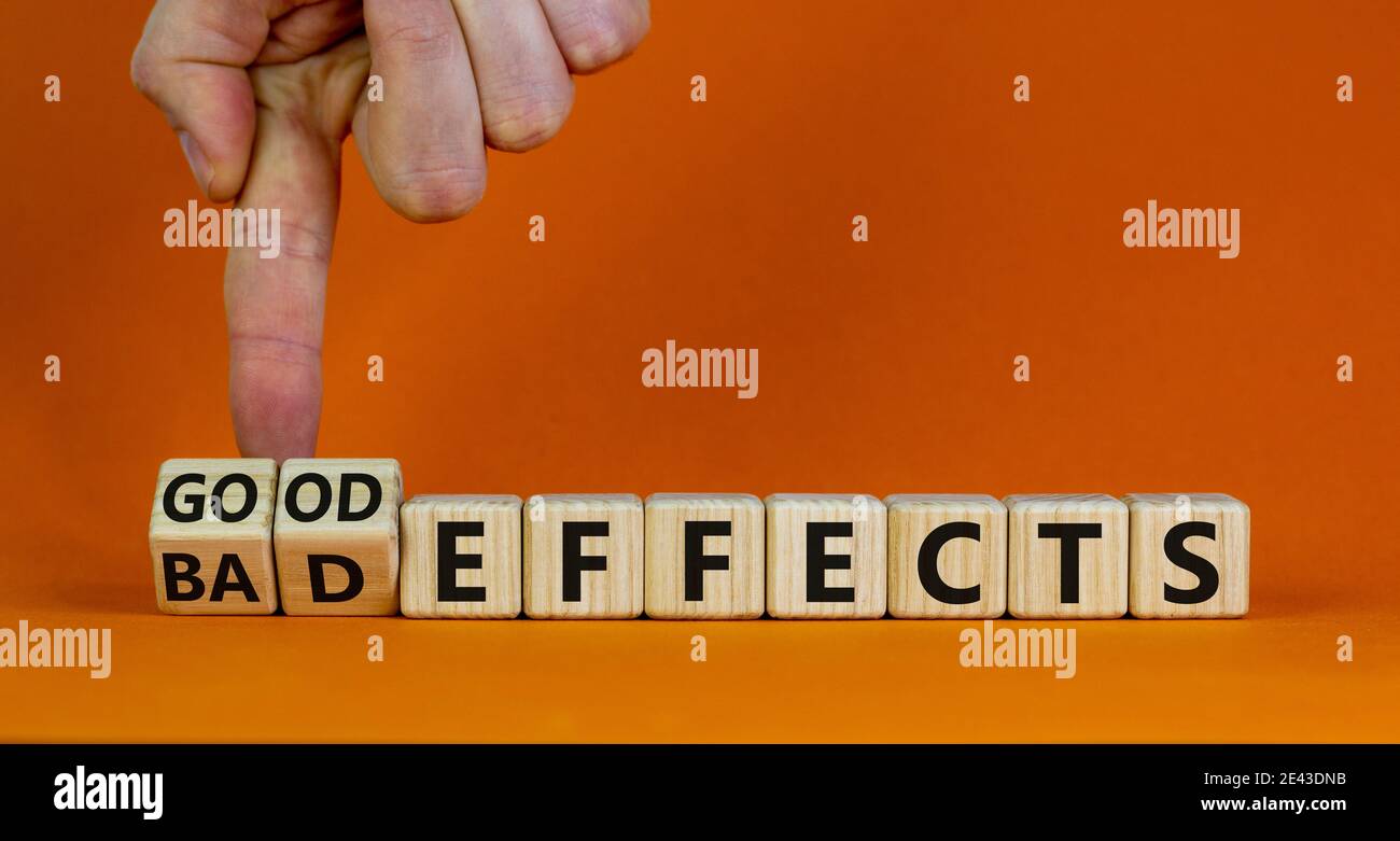 Bad or good effects symbol. Businessman turns wooden cubes and changes ...