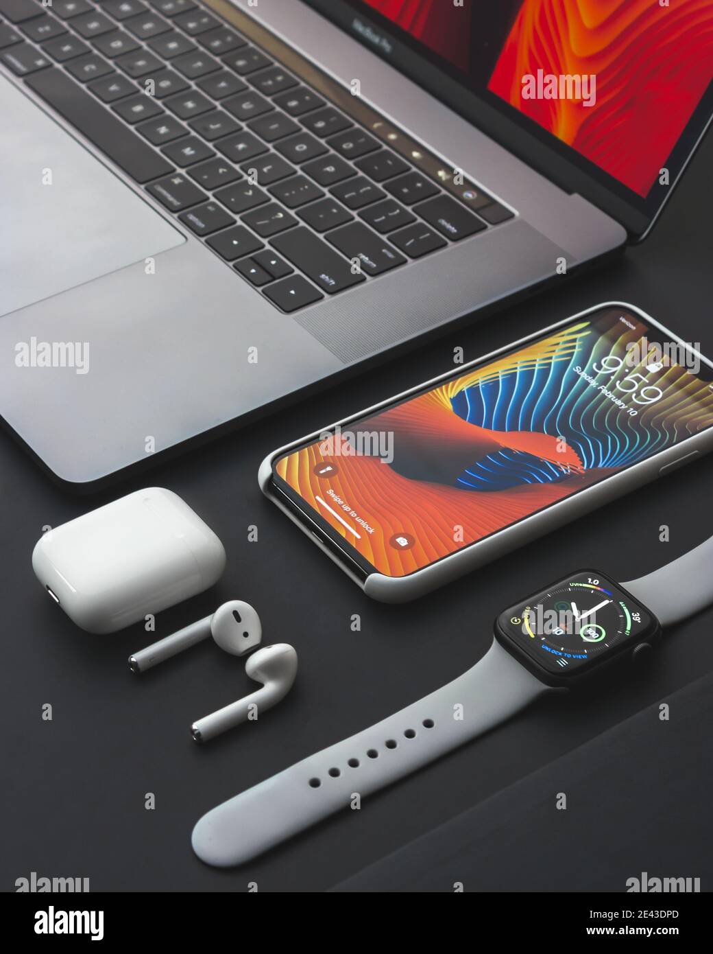 Office work desk with a digital smartwatch, smartphone, modern laptop ...