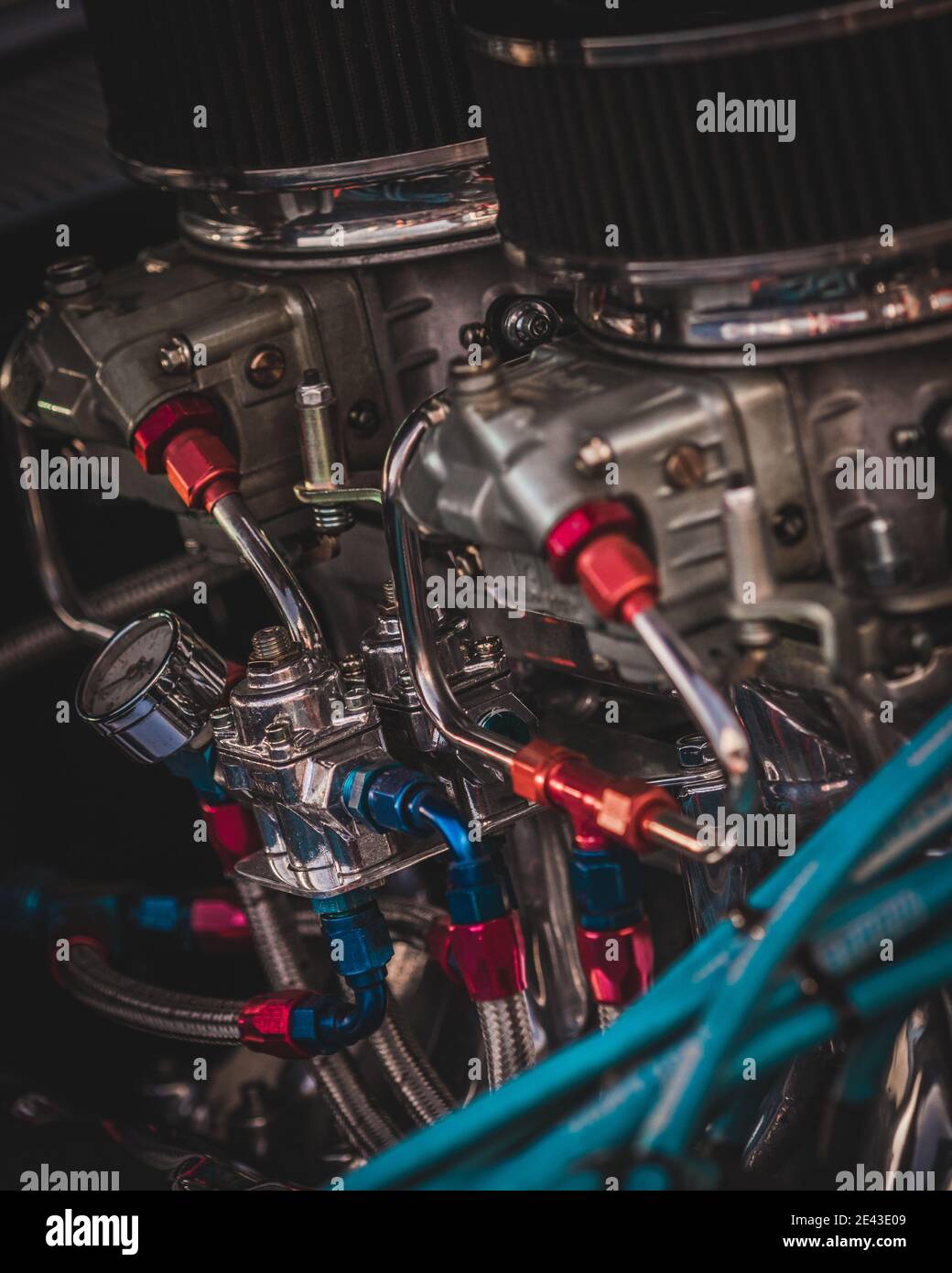 Closeup vertical shot of a metallic internal design of a car engine ...