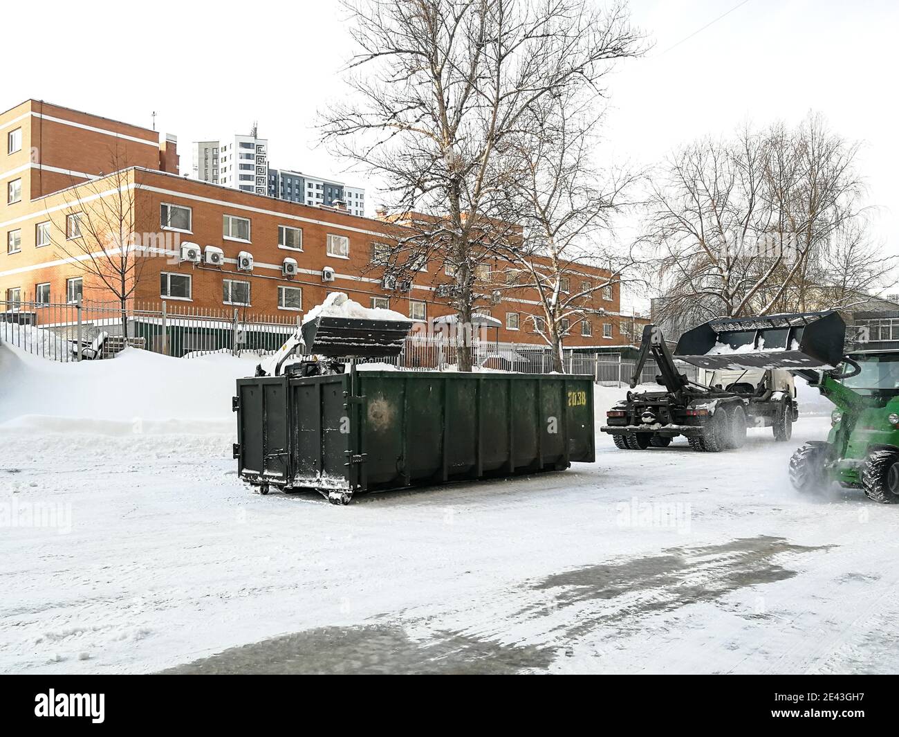 Moscow. Russia. January 15, 2021. Small front-end loaders clear snow ...