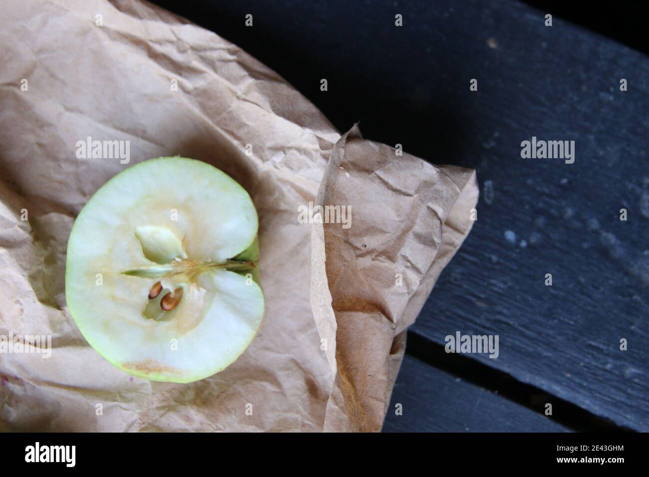 Half an apple on a vintage table. Food background Stock Photo - Alamy
