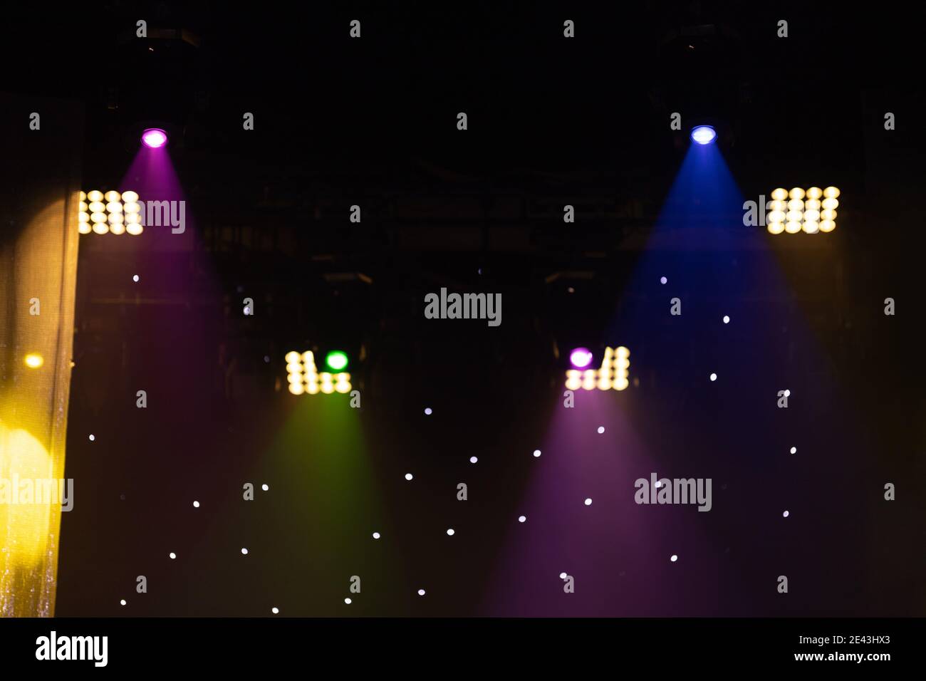 An empty stage of the theater, lit by spotlights and smoke before the ...