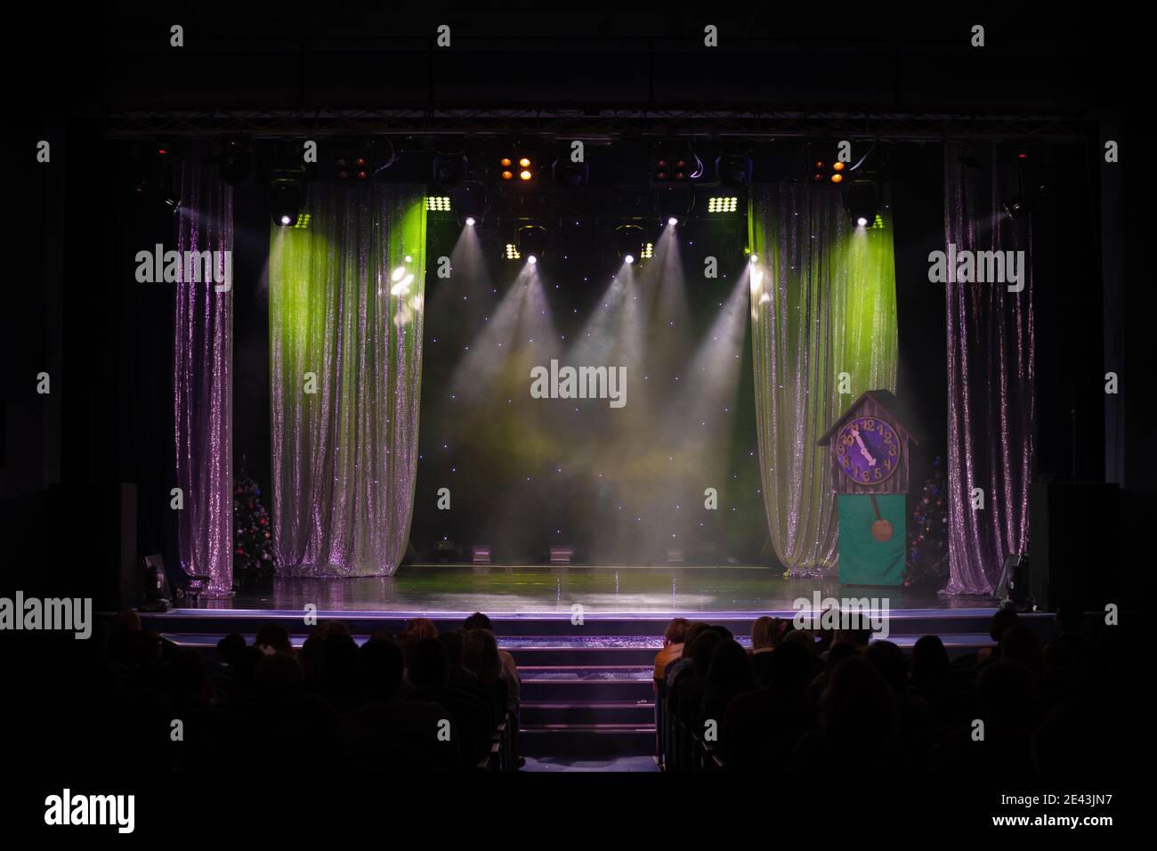 An empty stage of the theater, lit by spotlights and smoke before the ...