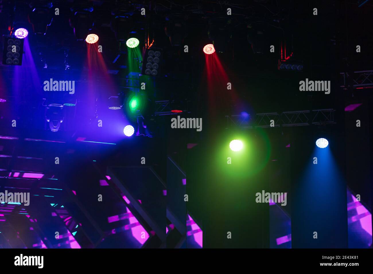 An empty stage of the theater, lit by spotlights and smoke before the ...