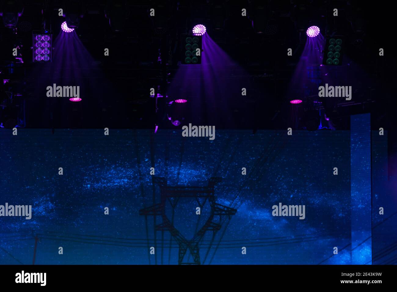 An empty stage of the theater, lit by spotlights and smoke before the ...