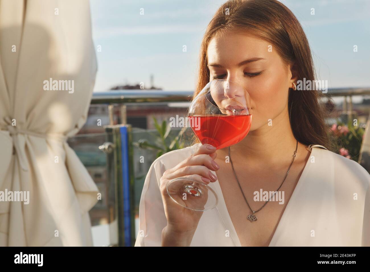 Beautiful woman balcony drinking alcohol hi-res stock photography and ...
