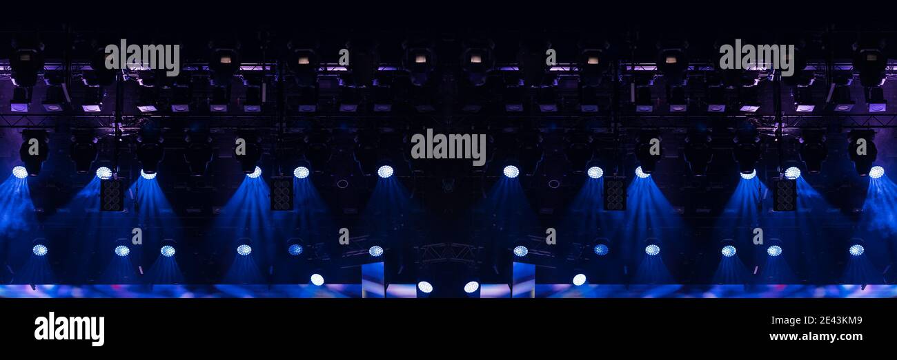 An empty stage of the theater, lit by spotlights and smoke before the ...