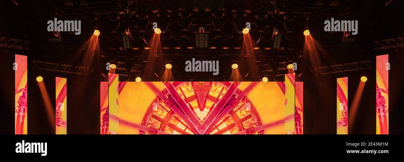 An empty stage of the theater, lit by spotlights and smoke before the ...