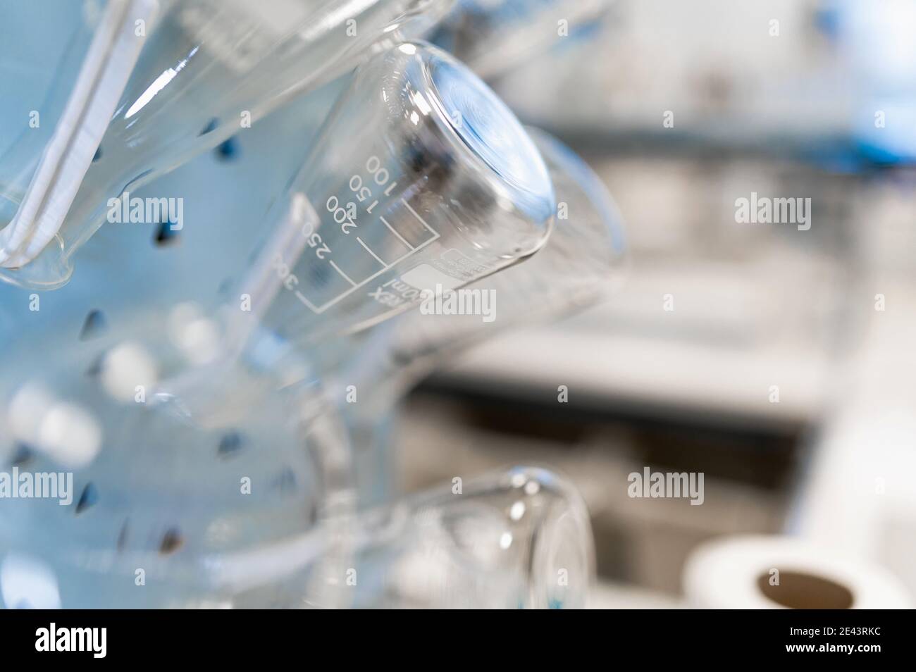 Closeup of empty glass flasks with measuring marks arranged in modern ...
