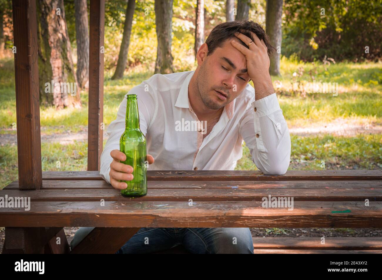 Drunk guy sitting table in hi-res stock photography and images - Alamy