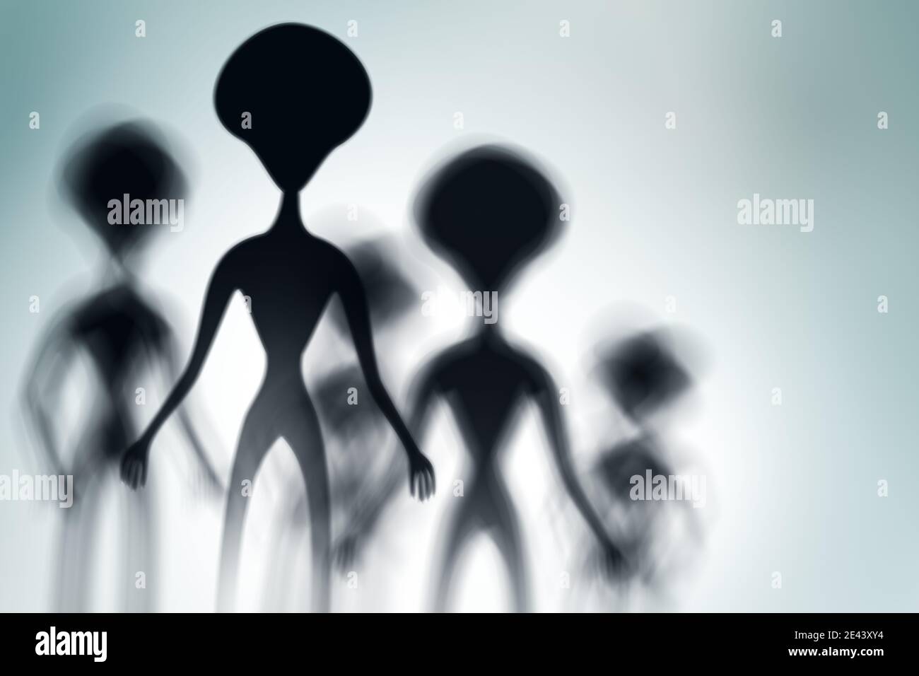 Silhouettes of spooky aliens and bright light on behind them - UFO ...