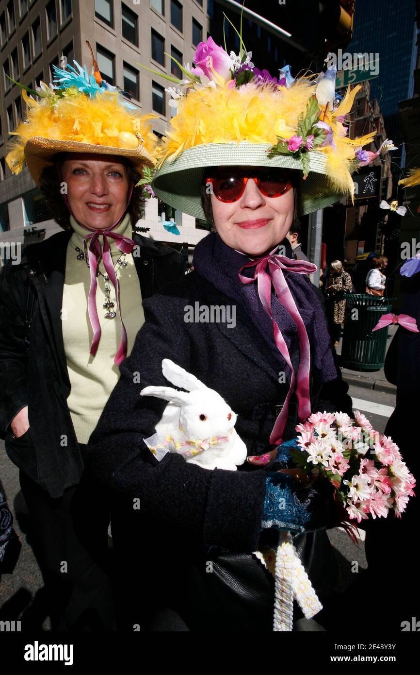 Mary Jaeger (white rabbit) and friend pose for pictures at the Easter ...