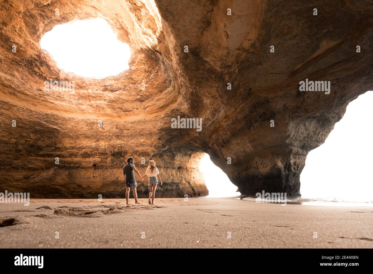 Woman walking in cave hi-res stock photography and images - Alamy