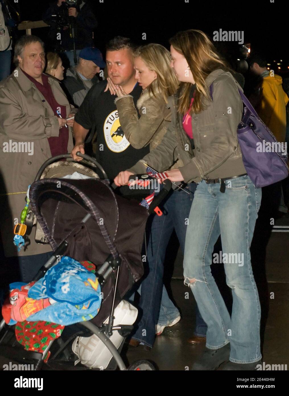 A crew member of the Maersk Alabama cargo ship walks with his family ...