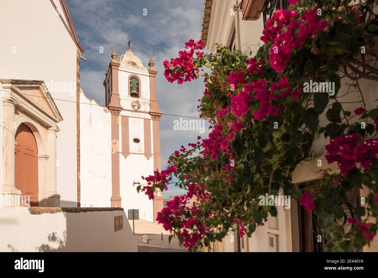 Traditional south Portugal white houses covered with flowers in Algarve ...