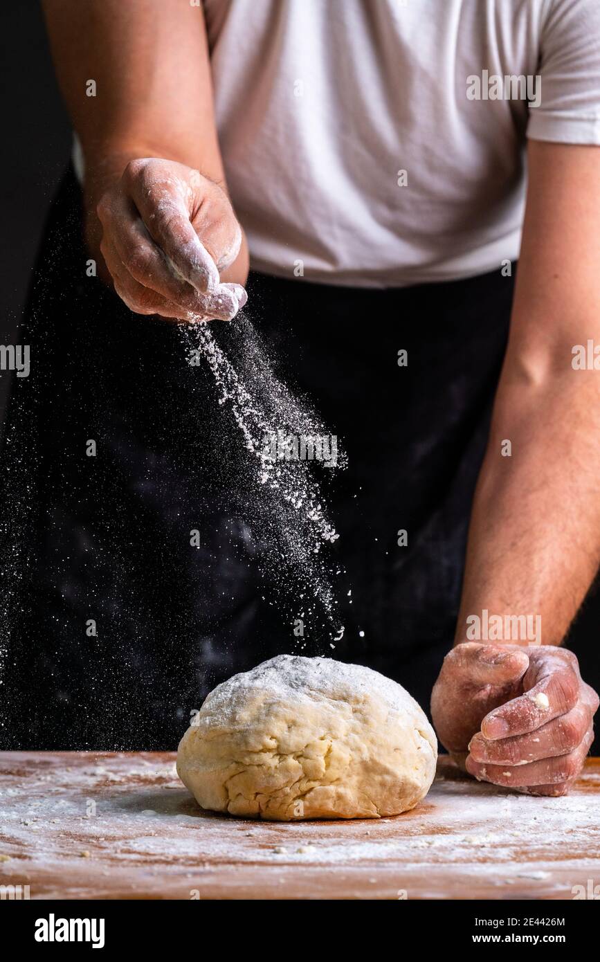 Sprinkling powder hands hi-res stock photography and images - Alamy