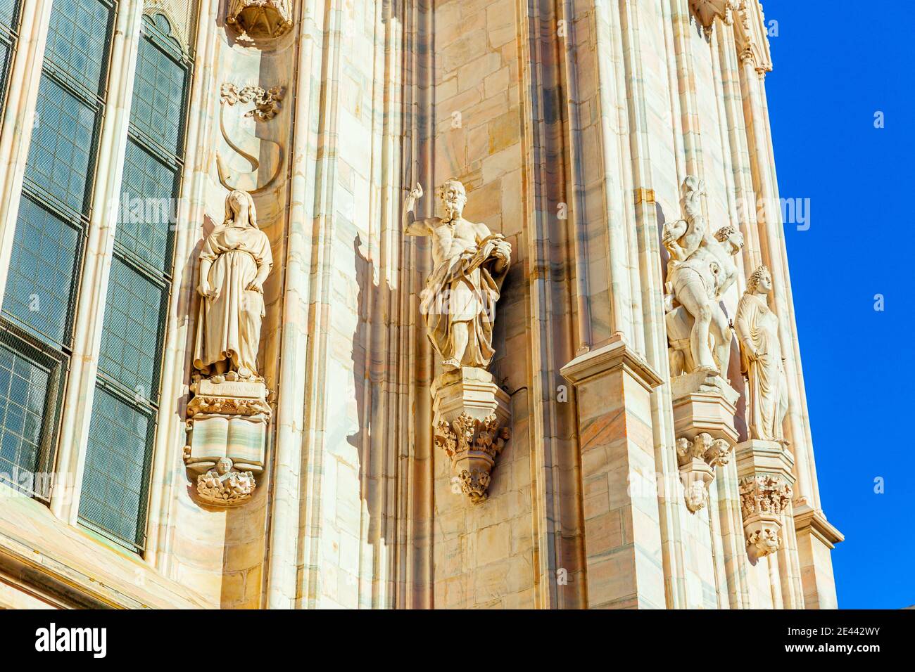 Facade of Milan Cathedral Duomo di Milano with Gothic spires and white ...