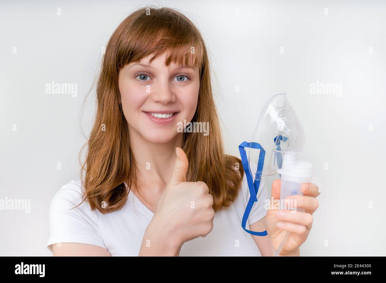 Woman doing inhalation with nebulizer at home - medical inhalation ...