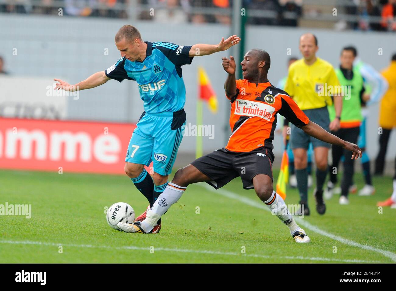 Marseille's Benoit Cheyrou battles Lorient's Michael Ciani during the ...