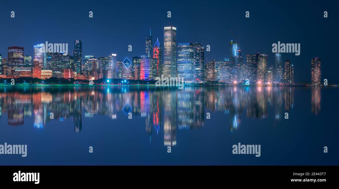 Night cityscape of Chicago with contemporary buildings and towers ...