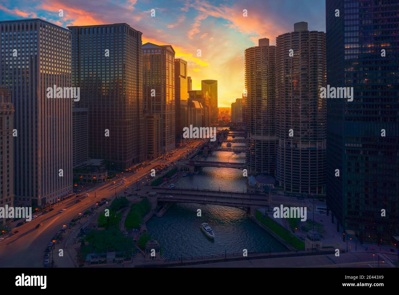 Amazing sunset over Chicago Riverwalk with bridges over river and glass ...