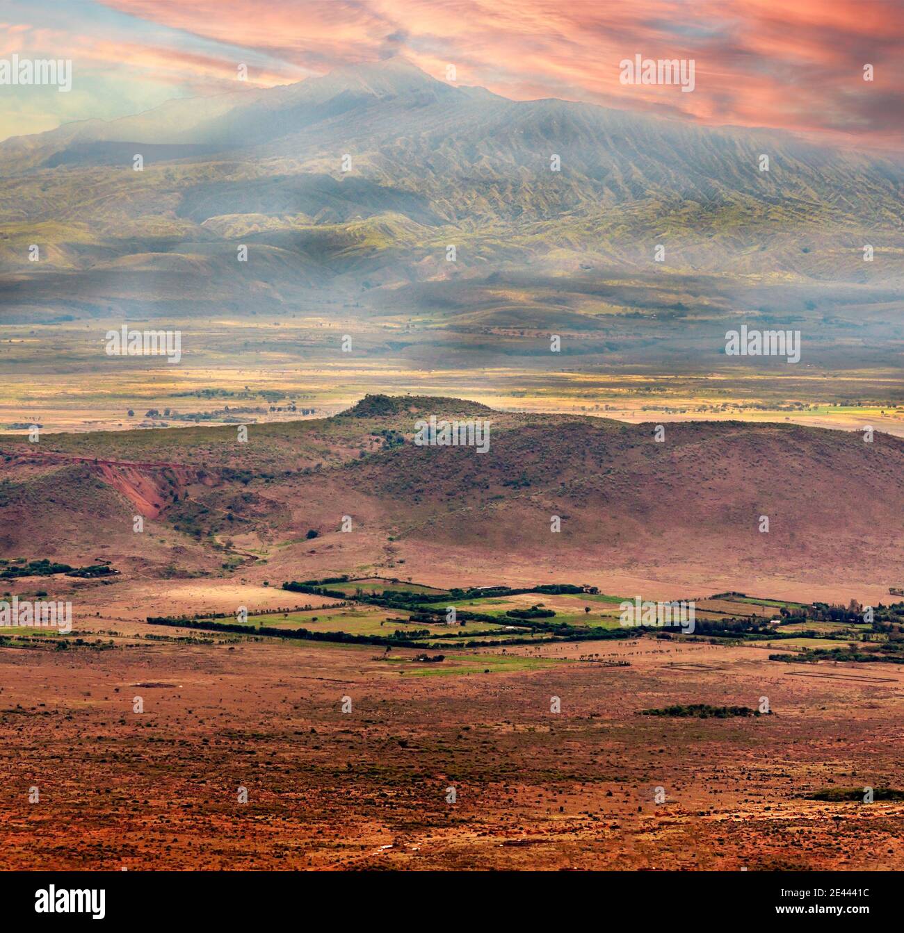 Kenyan valley with mountains in the background below dramatic sunset ...