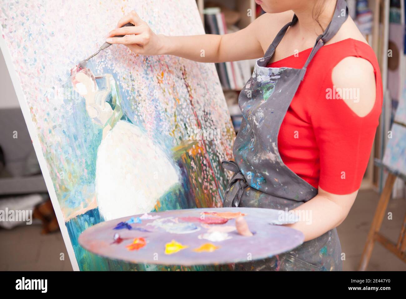 Unrecognizable female painter drawing an artwork at her studio. Art ...