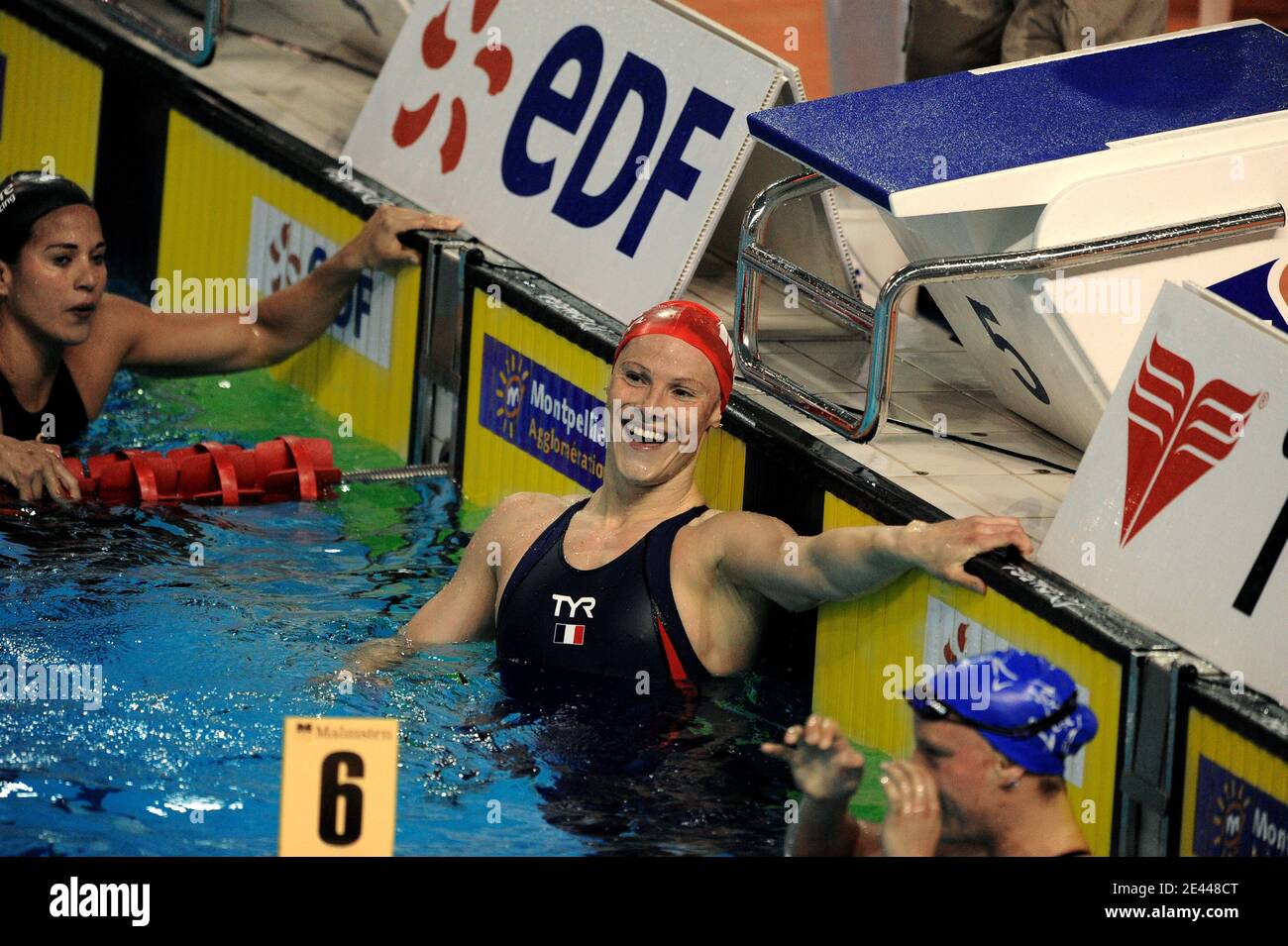 France's Aurore Mongel swimming and winning the 100 M Butterfly during ...