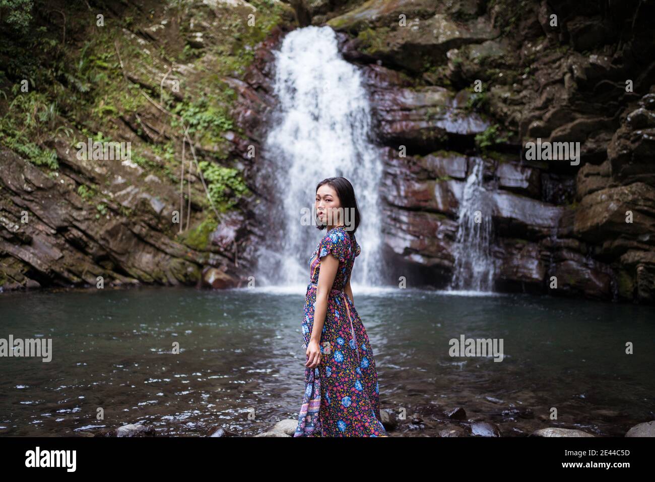 Trendy slim millennial female model in bright red leather jacket and ...