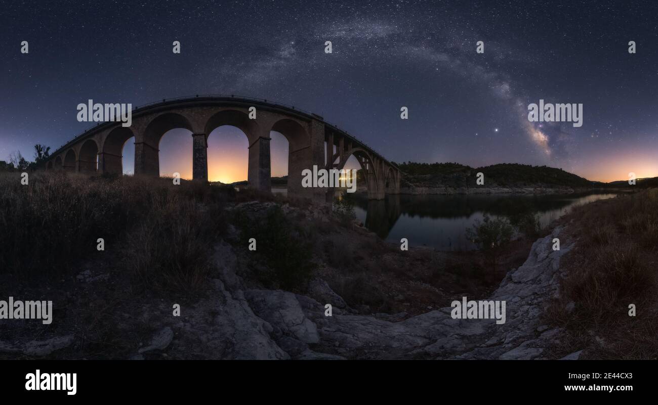 Wide angle of viaduct bridge under night sky with sparkling stars in ...