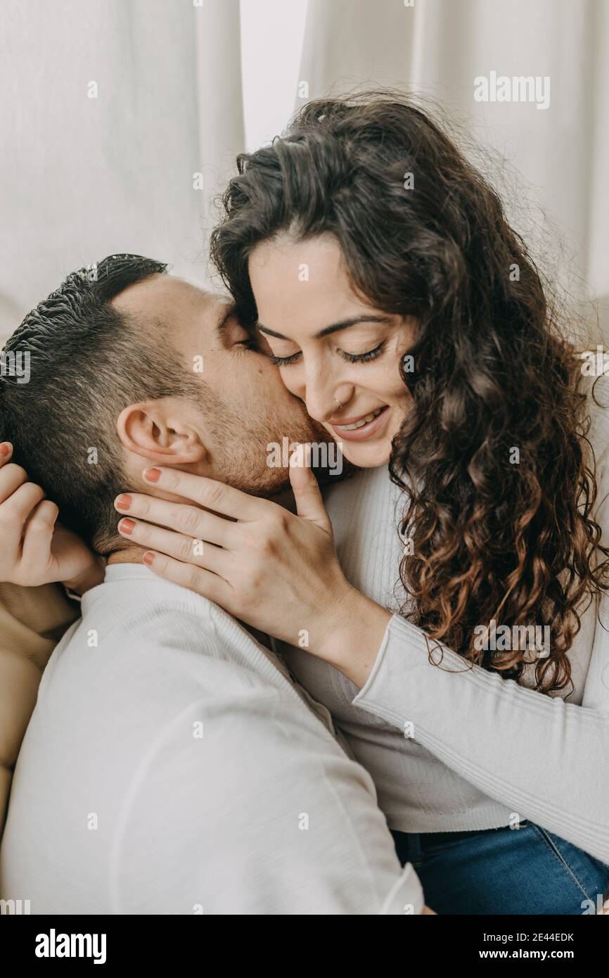 Couple bed bedroom kiss love romance hugging hi-res stock photography ...