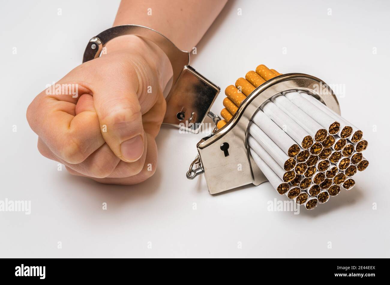 Addiction concept cigarettes handcuffs hi-res stock photography and ...