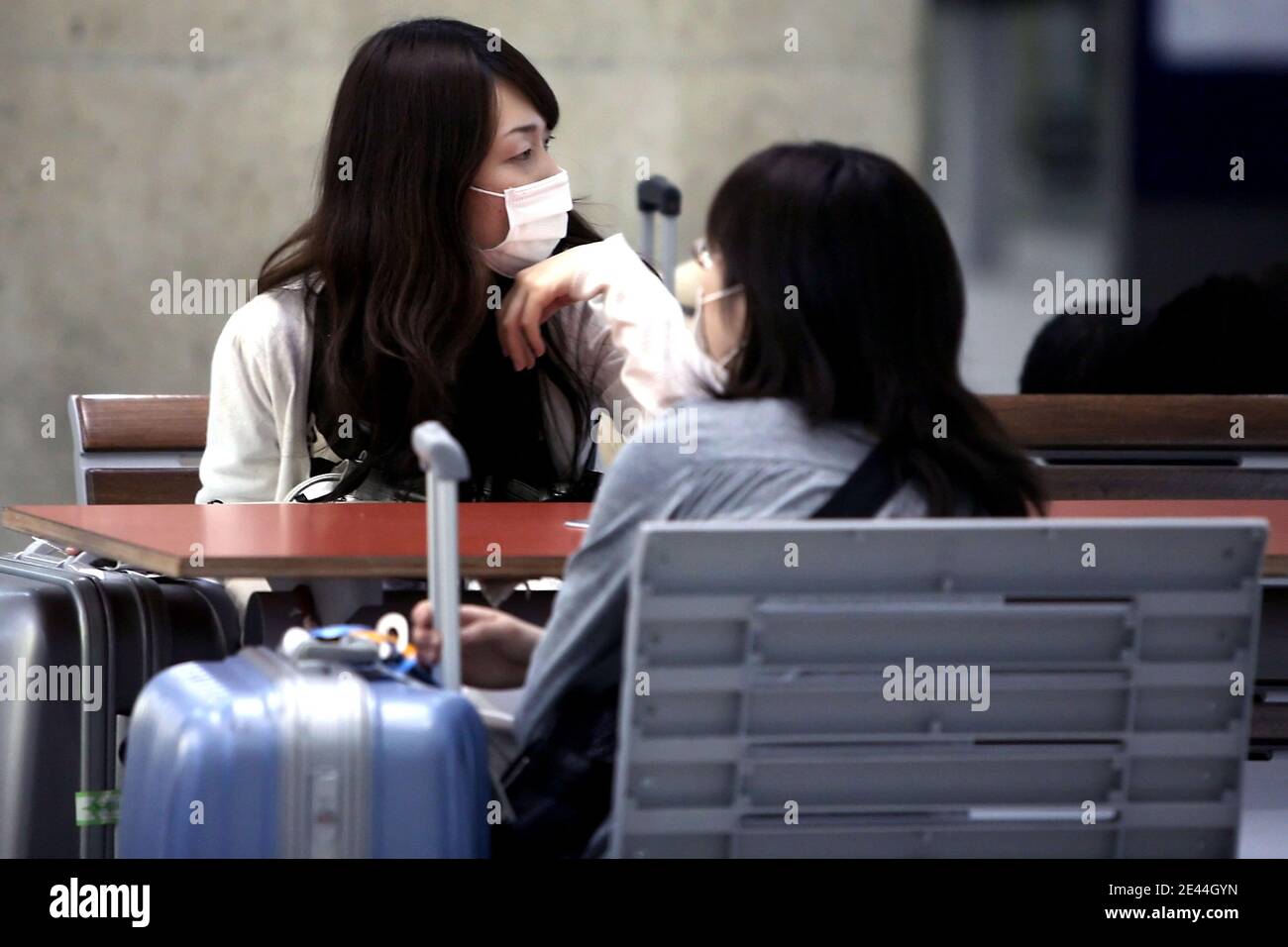 Japanese girls wear masks in precaution against swine influenza when ...