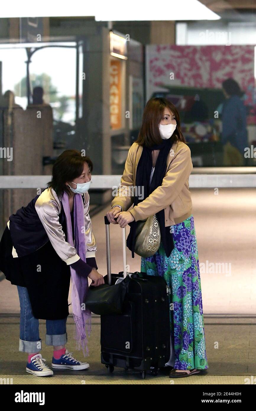 Japanese girls wear masks in precaution against swine influenza when ...