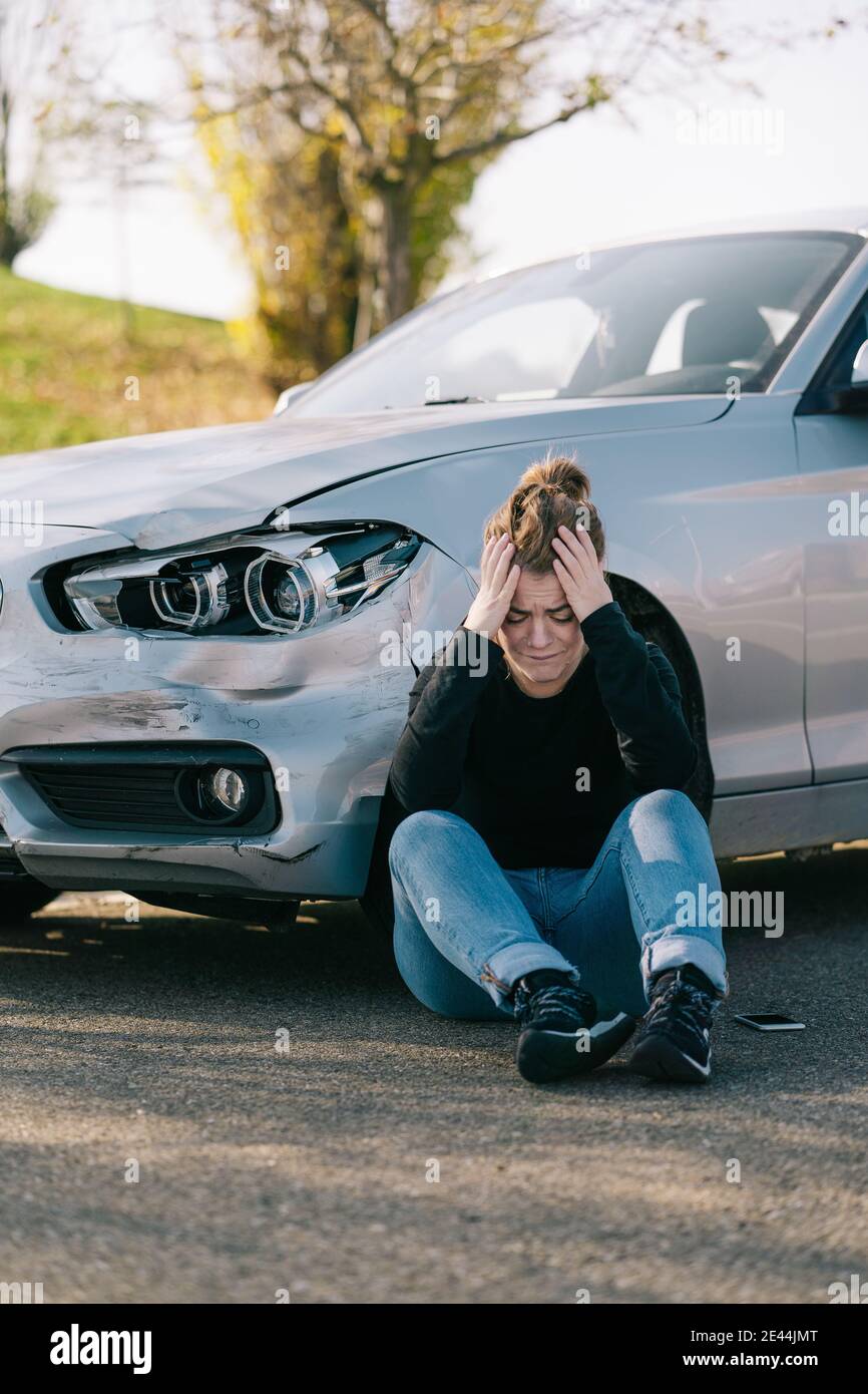 Woman crying after car accident hi-res stock photography and images - Alamy