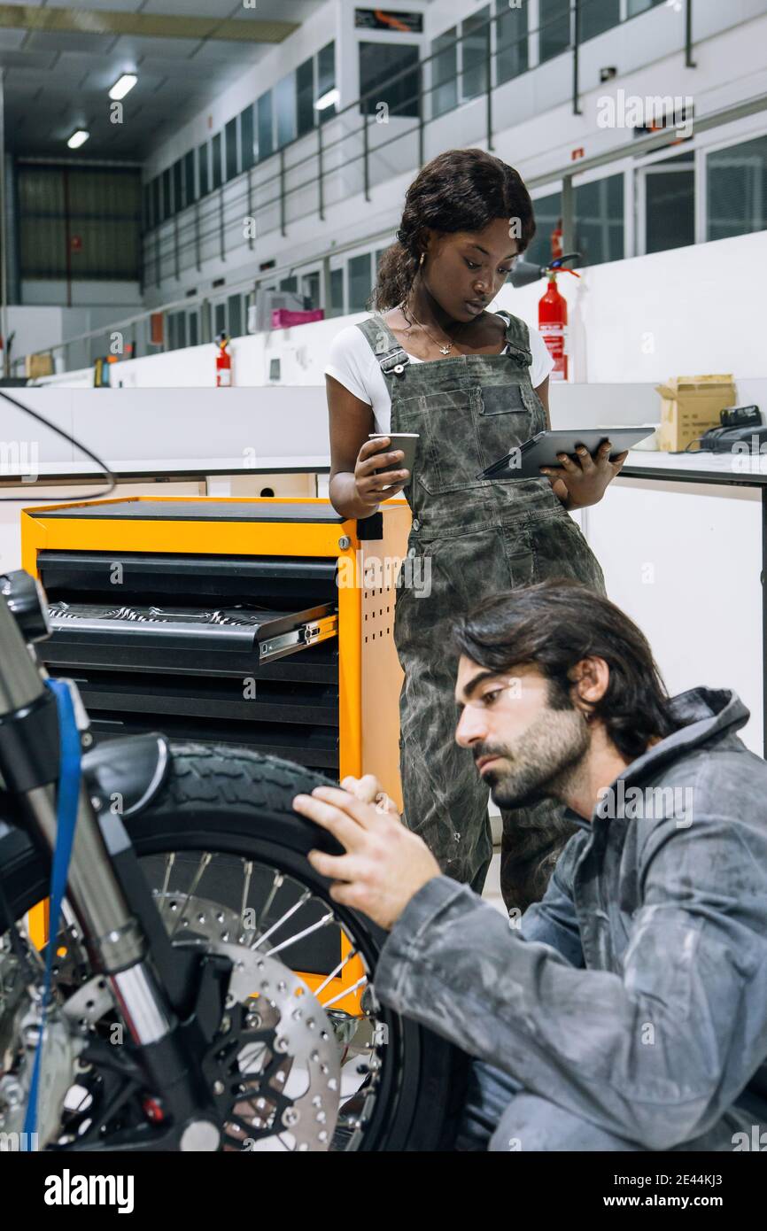 Young cheerful best multiethnic friends with delicious pastries and ...