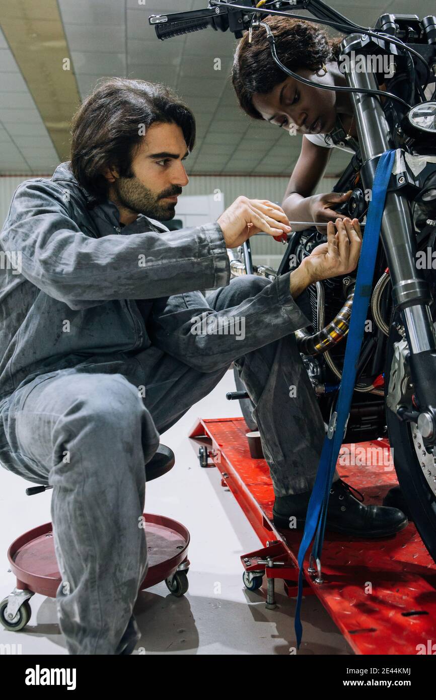 Male female motorbike mechanic hi-res stock photography and images - Alamy
