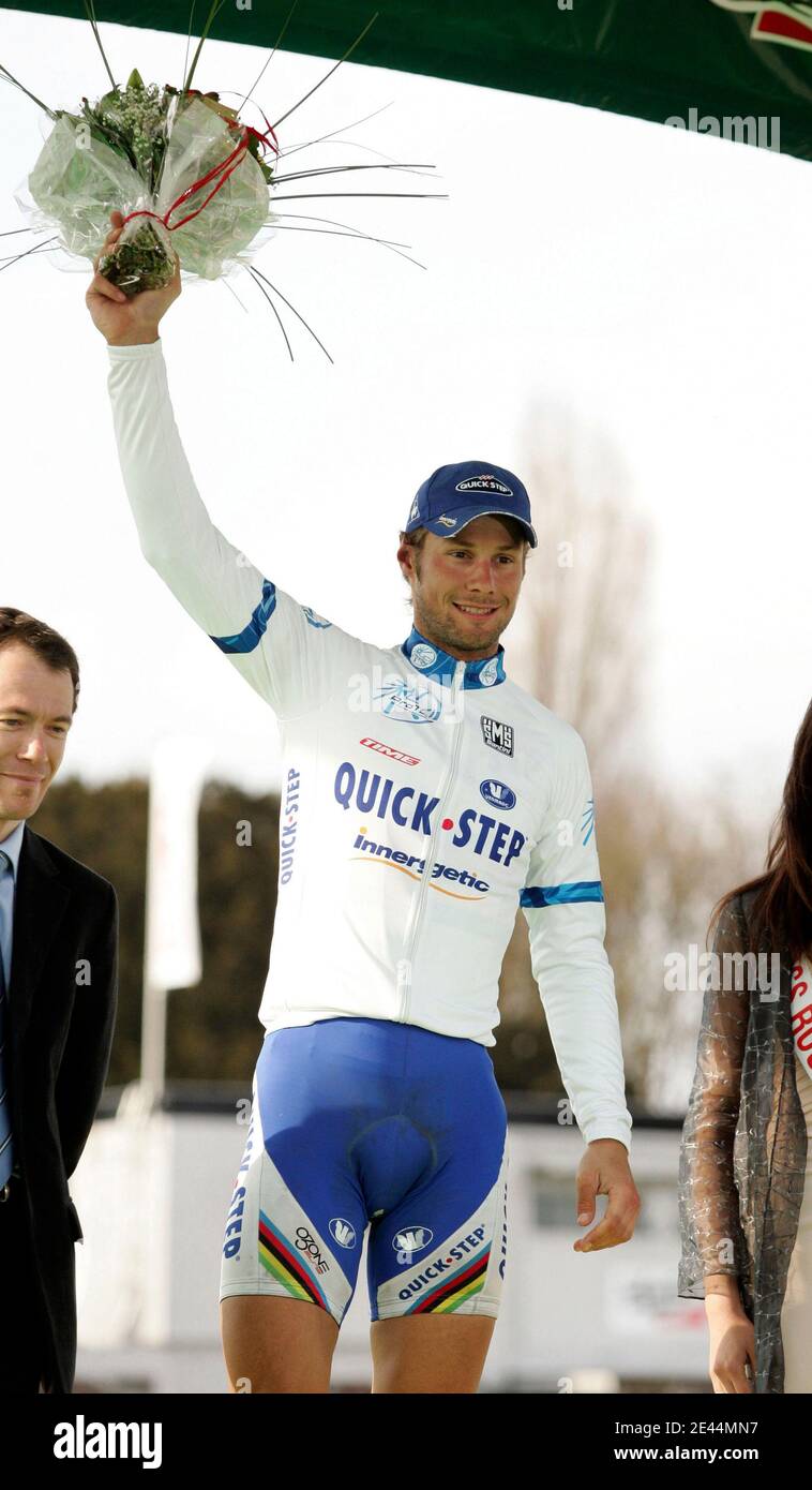 Belgian cyclist Tom Boonen celebrates with flowers on the podium after ...