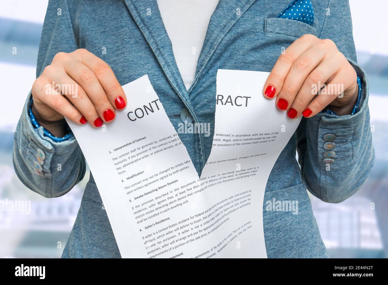 Business woman tearing contract in office - breaking contract Stock ...