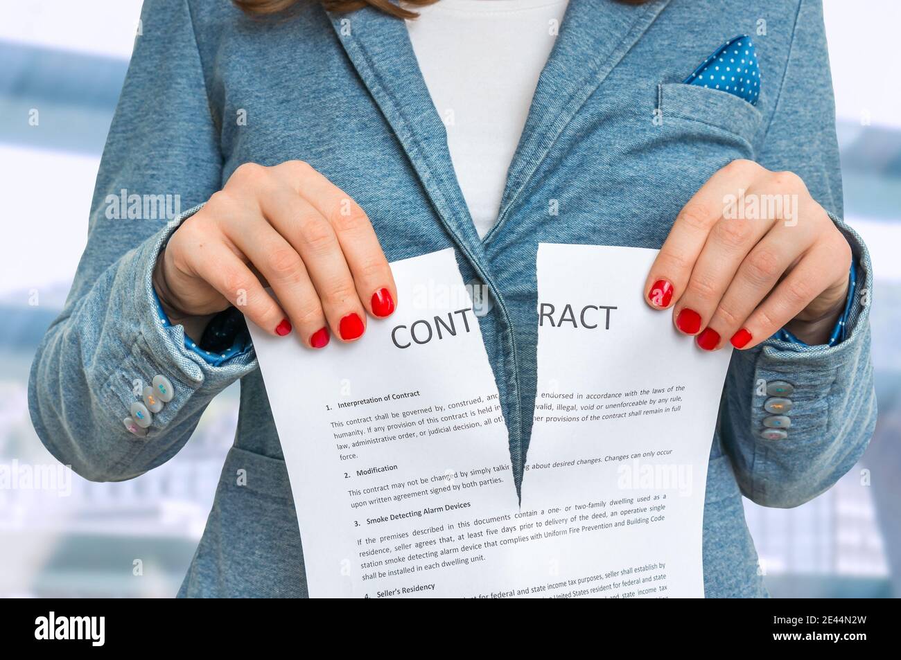 Business woman tearing contract in office - breaking contract Stock ...
