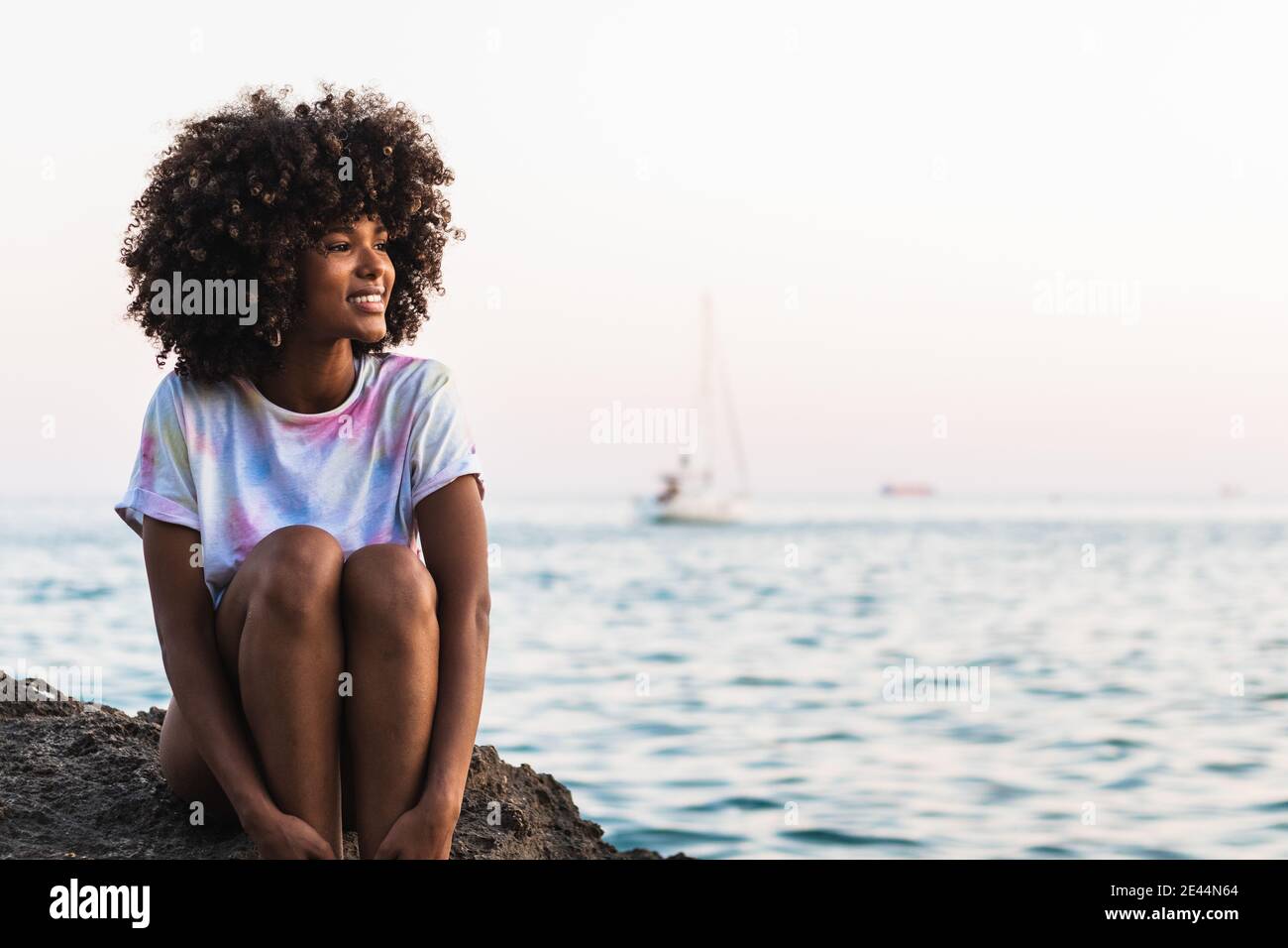 Side view of stylish female customer in summer outfit and sunglasses ...