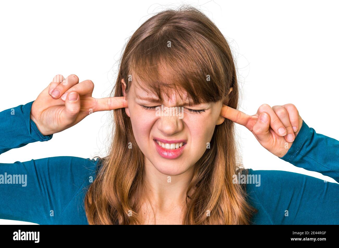 Woman closes ears with fingers to protect from loud noise isolated on ...