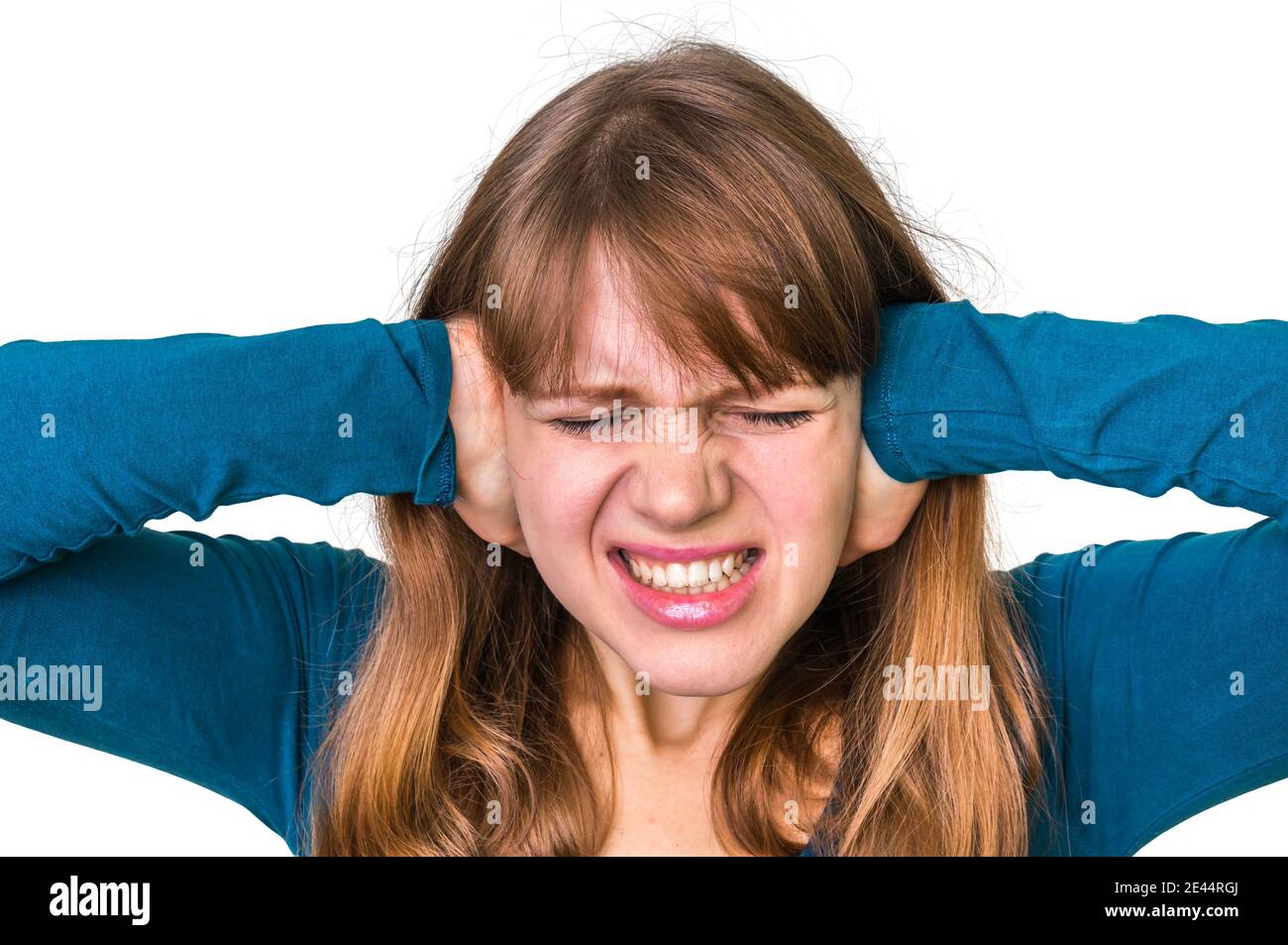 Stressed woman covering her ears to protect from loud noise isolated on ...