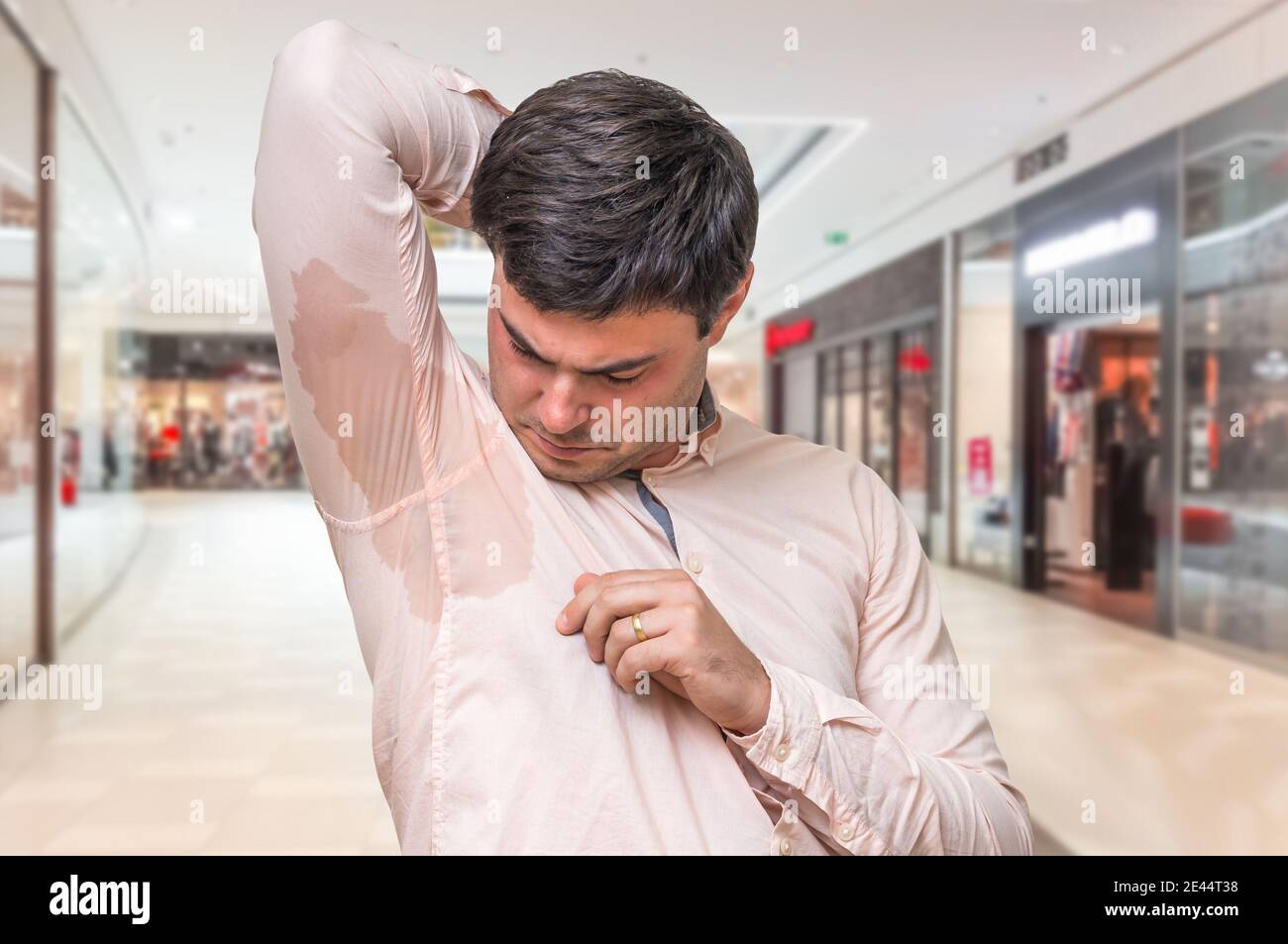 Young man hyperhidrosis pointing hi-res stock photography and images ...