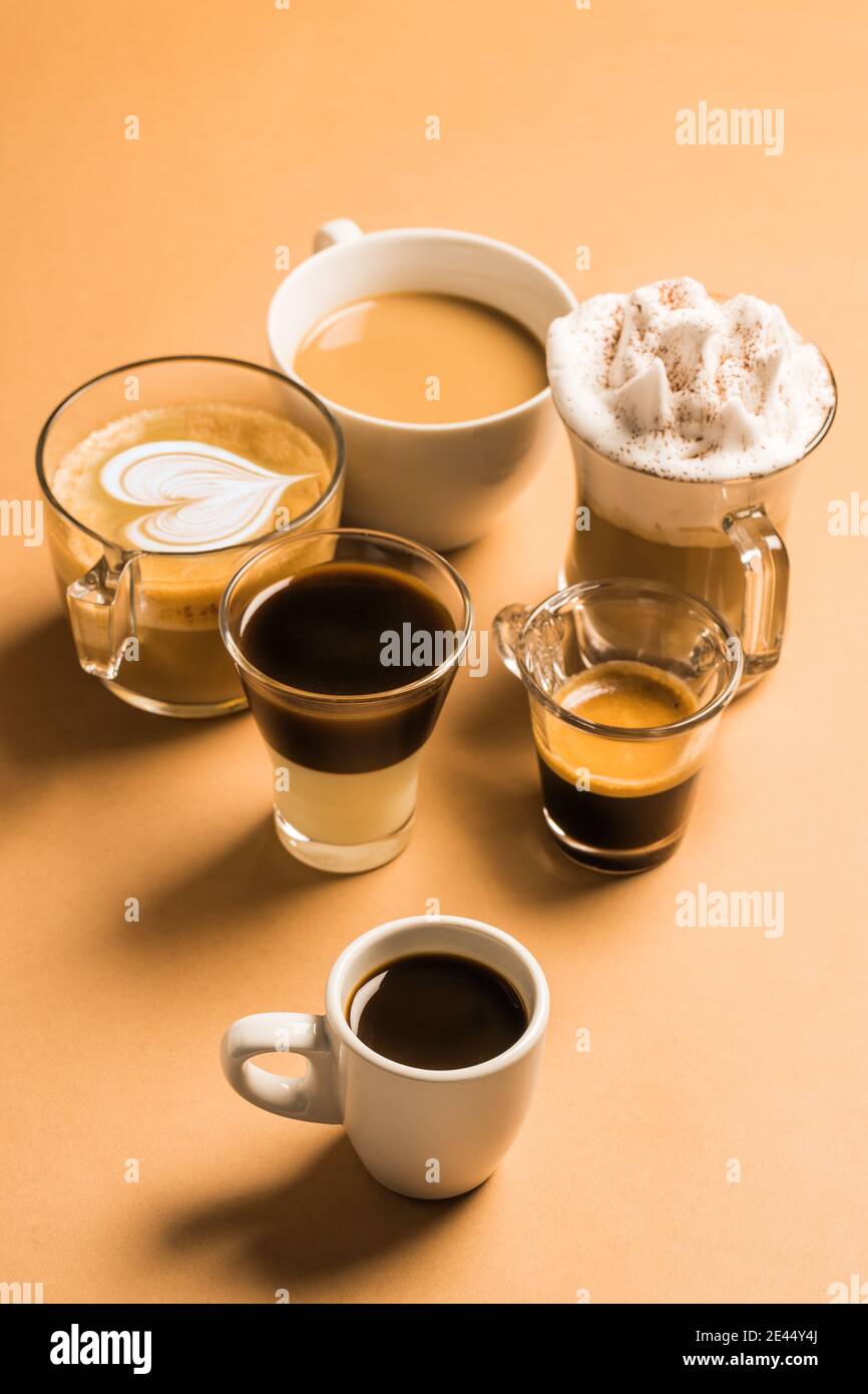 High angle set of different classic kinds of aromatic coffee drinks ...