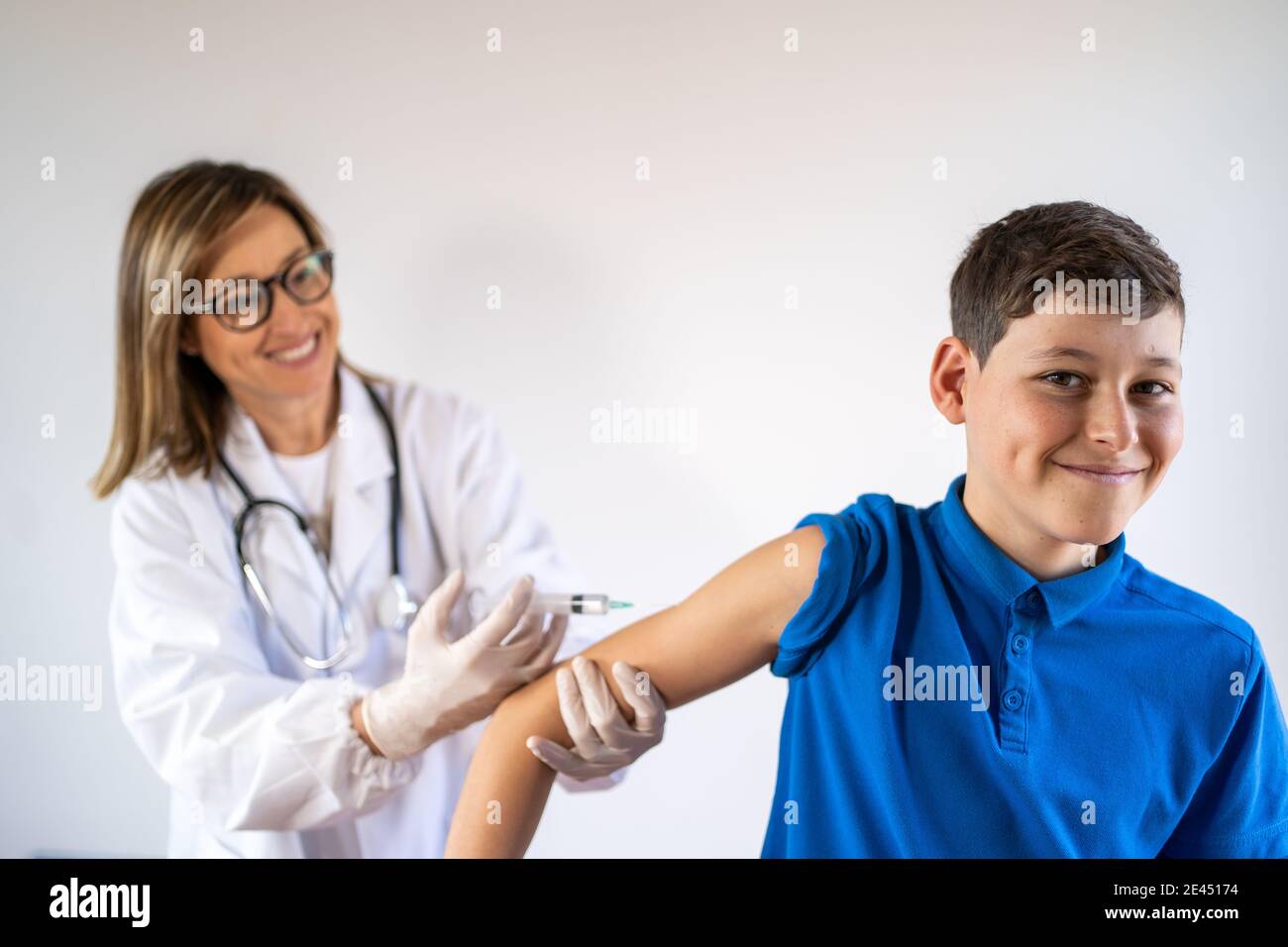 Female doctor giving vaccine injection vaccine from coronavirus for ...