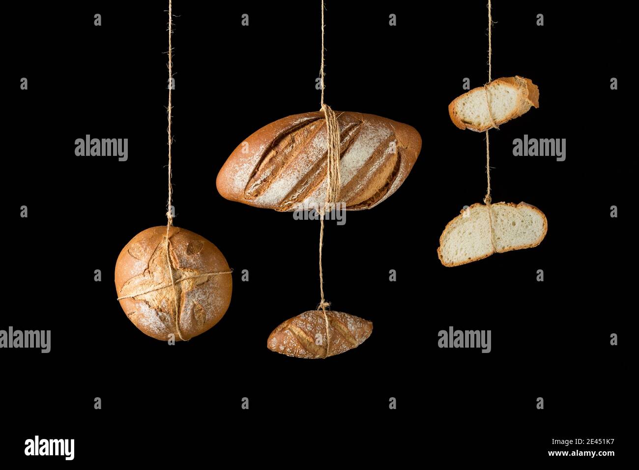 Loafs and pieces of fresh artisan crispy bread of various shapes and ...