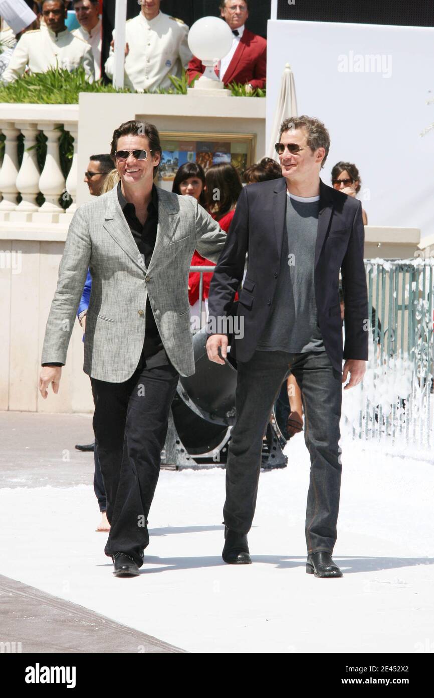 Jim Carrey (L) and Colin Firth at a photocall for new Disney animated ...
