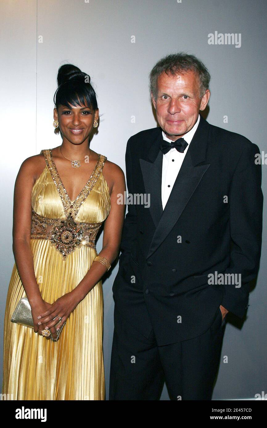 Patrick Poivre d'Arvor and a friend arriving at 'Madame Figaro' party ...