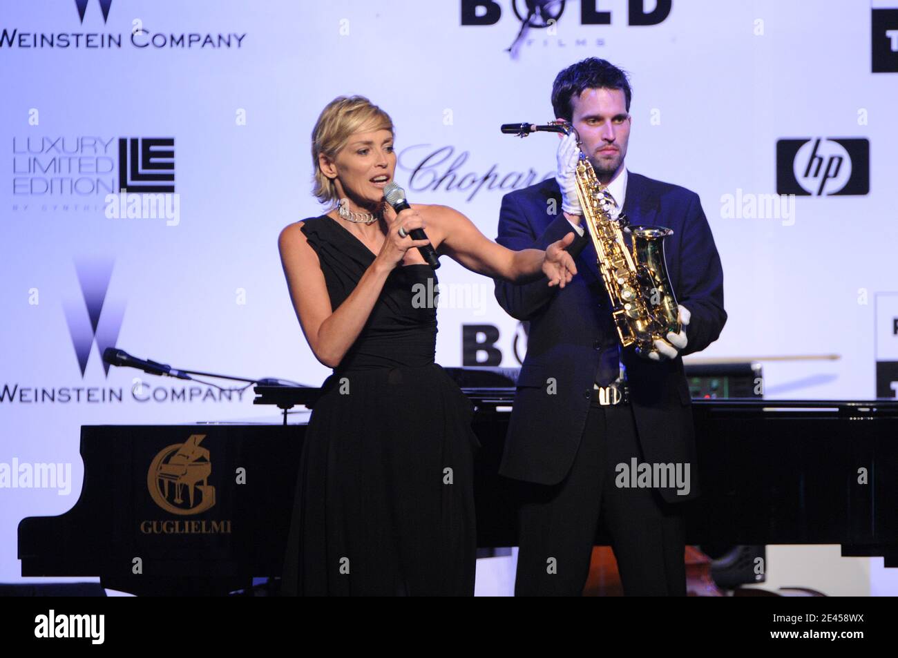 Sharon Stone conducted the live auction with a saxophone owned by Bill ...